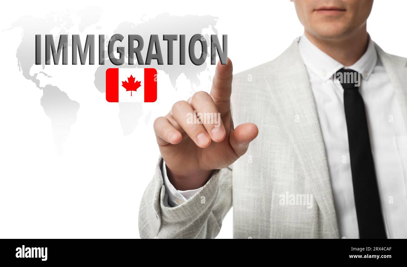 Immigration. Businessman touching digital screen with word and flag of ...