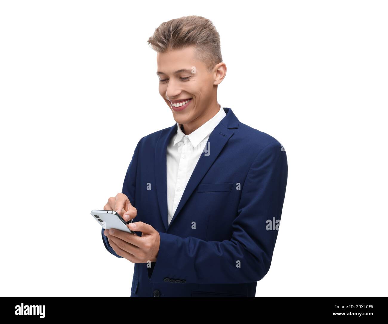 Happy young man sending message via smartphone on white background ...