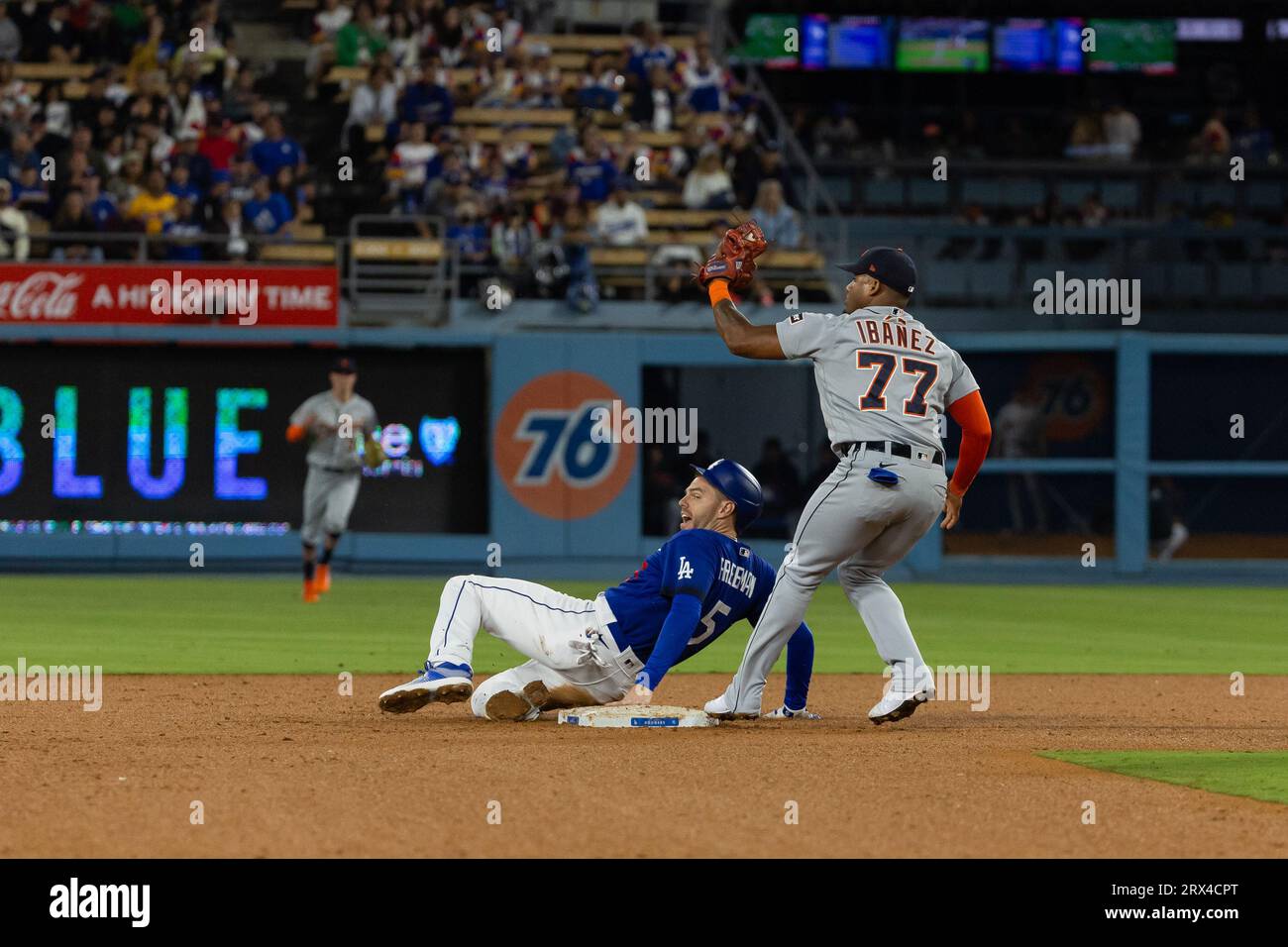 Detroit Tigers second baseman Andy Ibanez (77) tags out Los Angeles Dodgers first baseman ...