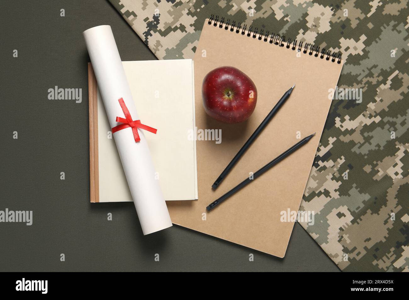Stationery, apple and diploma on color background, flat lay. Military ...