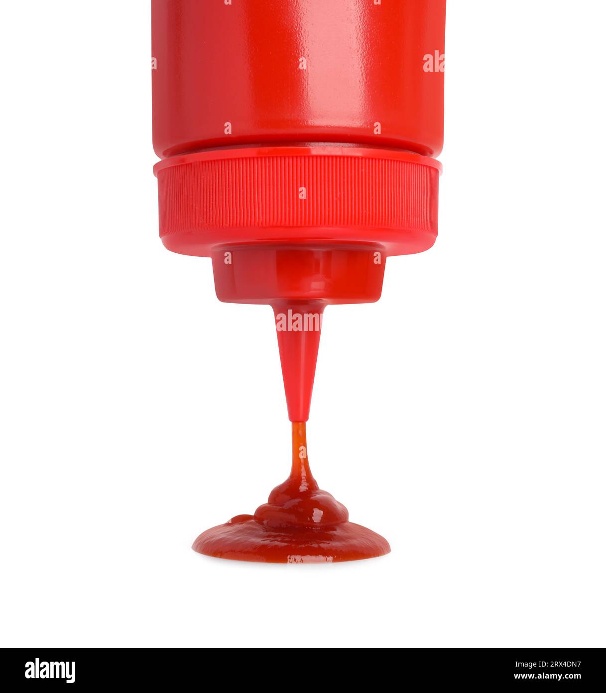 Pouring tasty red ketchup from bottle isolated on white Stock Photo - Alamy