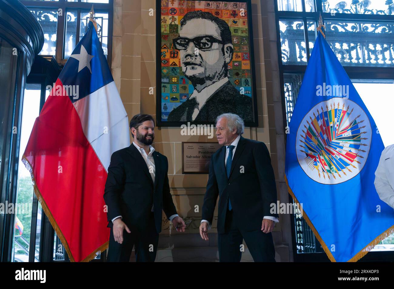Chile's President Gabriel Boric, left accompanied by Secretary General ...