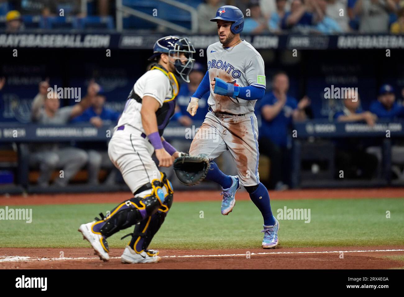 Toronto Blue Jays' George Springer, right, scores behind Tampa Bay Rays ...