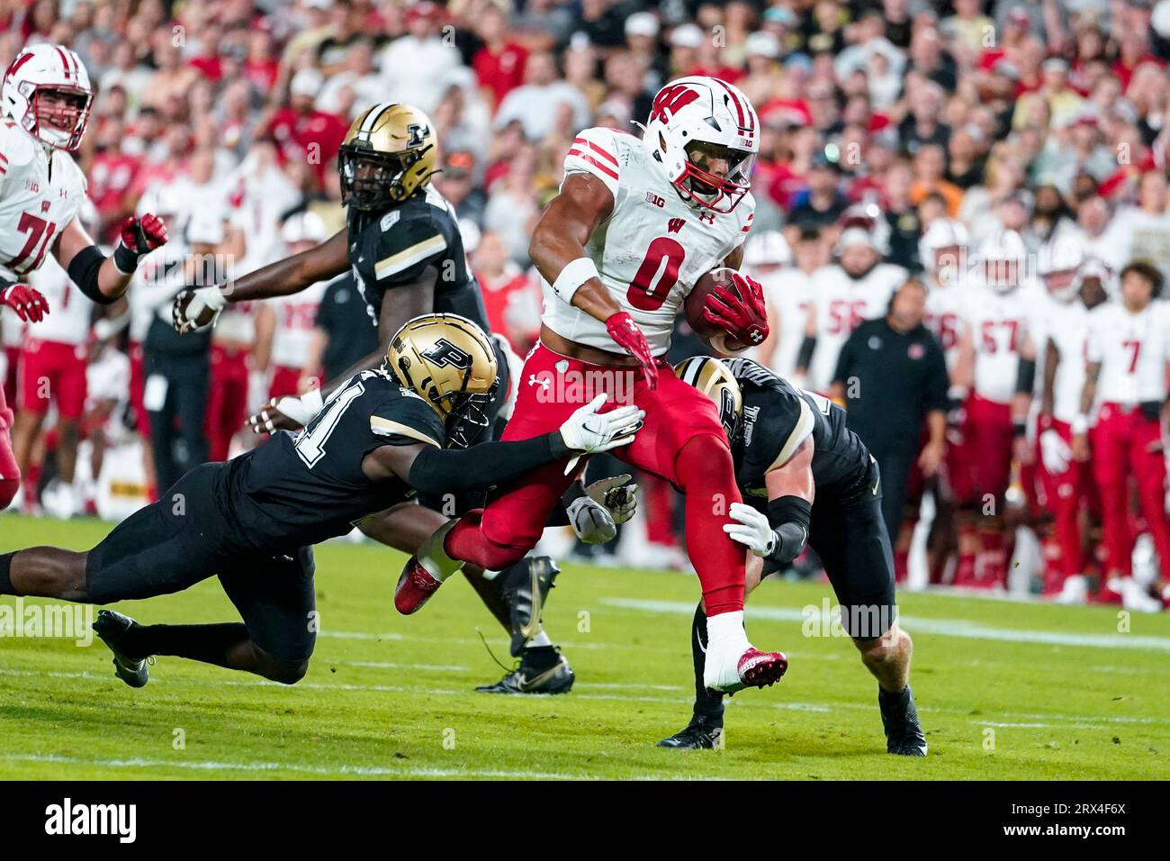 Wisconsin running back Braelon Allen (0) breaks the tackle of Purdue ...