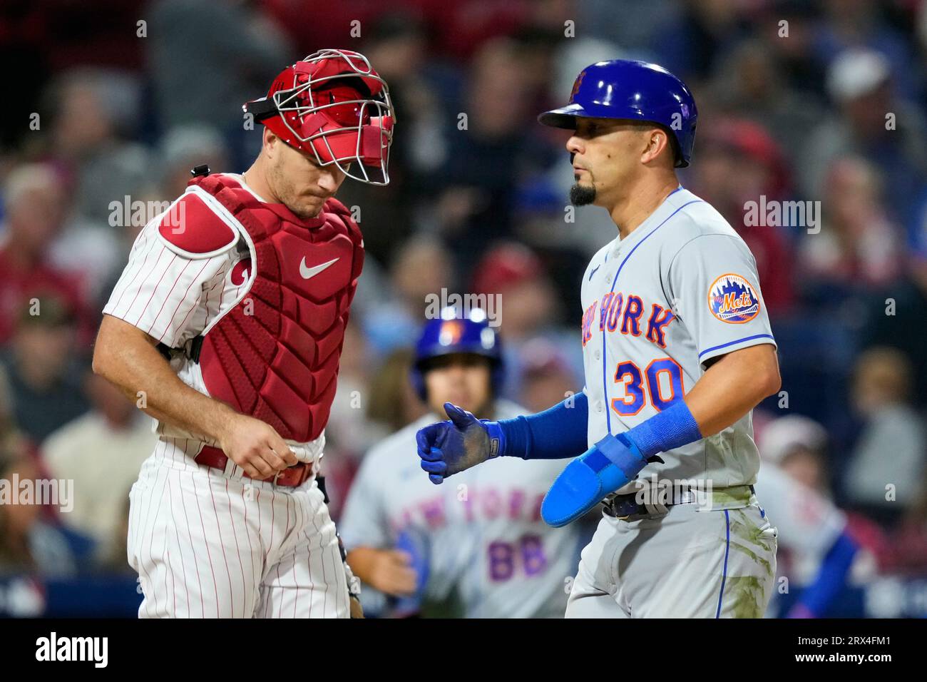 New York Mets' Rafael Ortega, right, scores past Philadelphia Phillies ...