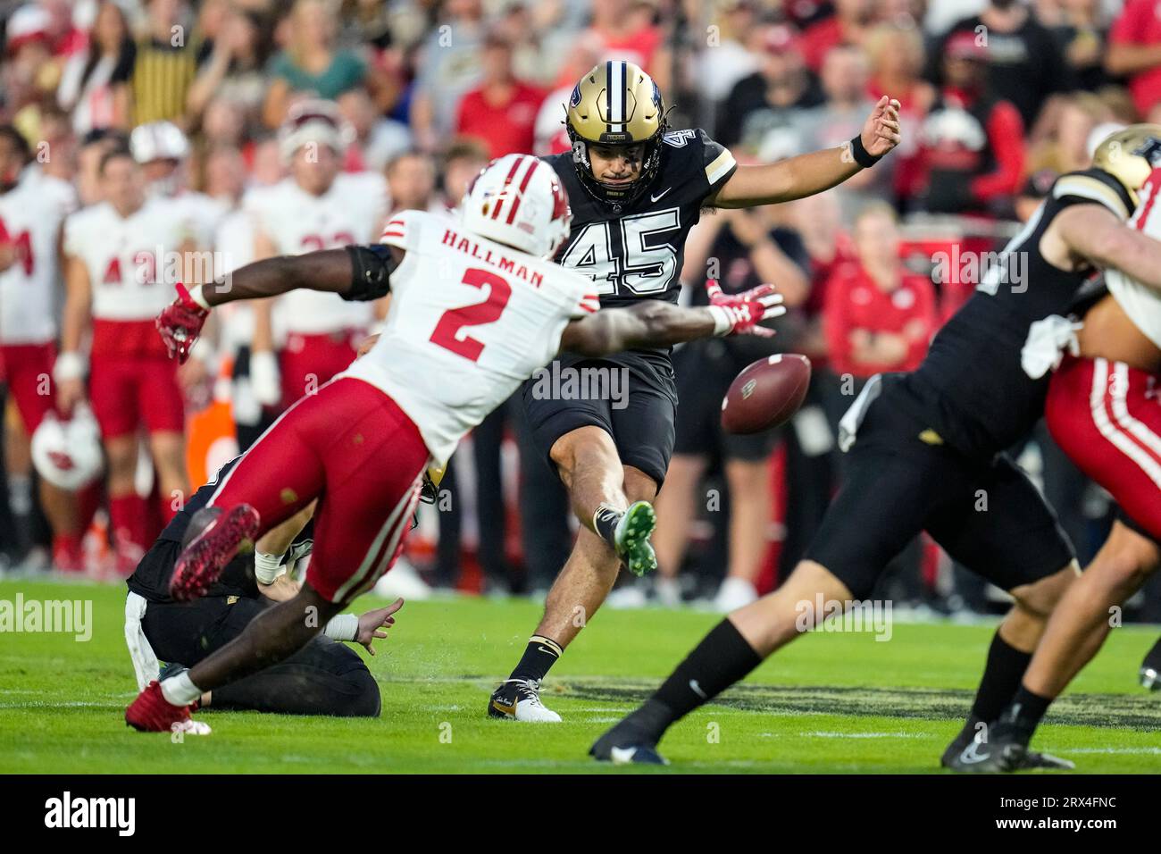 Purdue place kicker Julio Macias (45) kicks a field goal past Wisconsin ...