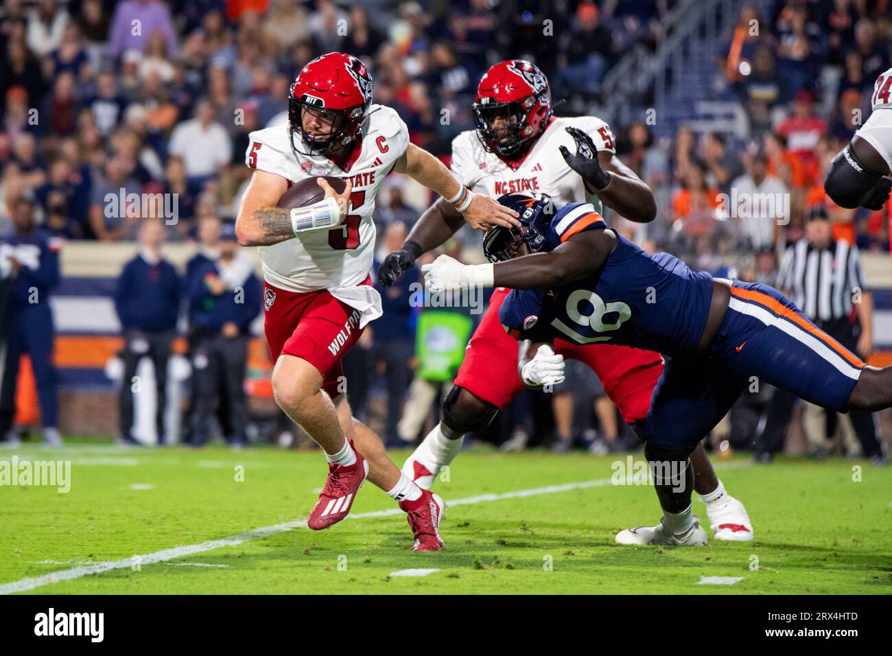 North Carolina State quarterback Brennan Armstrong (5) escapes the ...