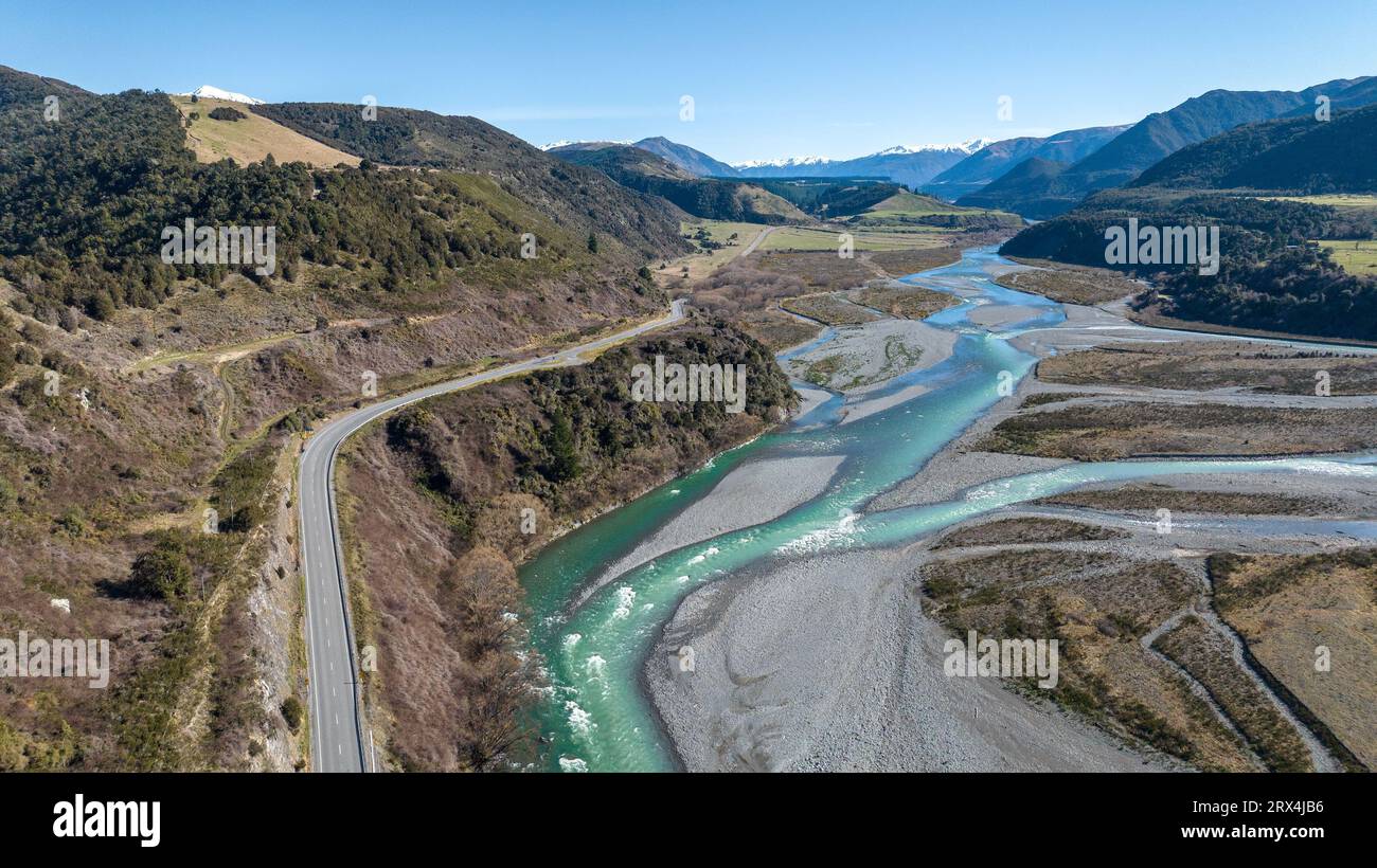 Aerial river forest and mountain scenery of the stunning road through ...