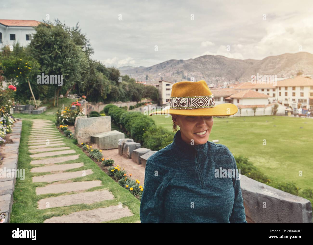 Beautiful Tourist with Hat in Qorikancha Inner Gardens. Cusco, Peru ...