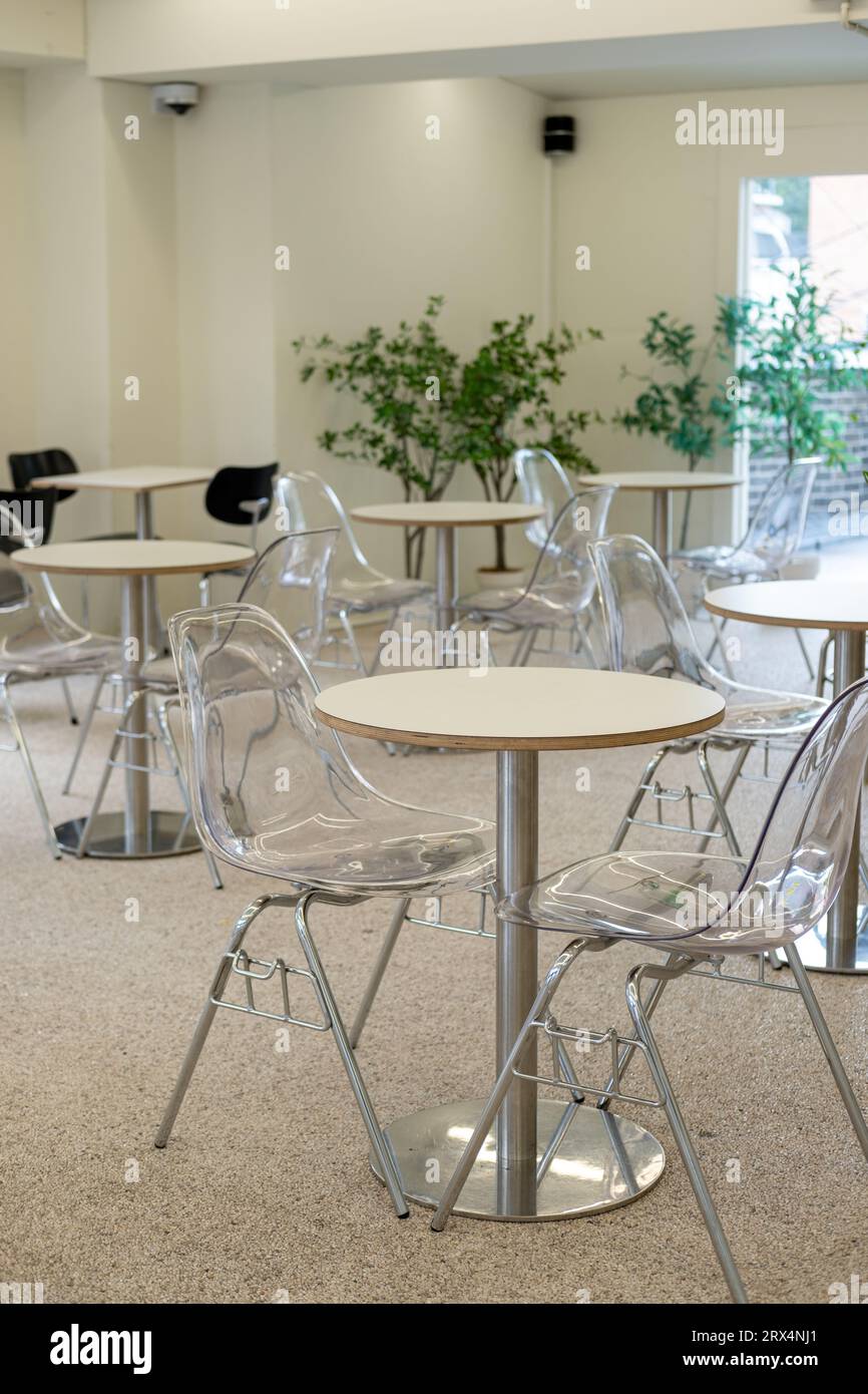 Seating inside the cafe or restaurant, with transparent chairs and ...