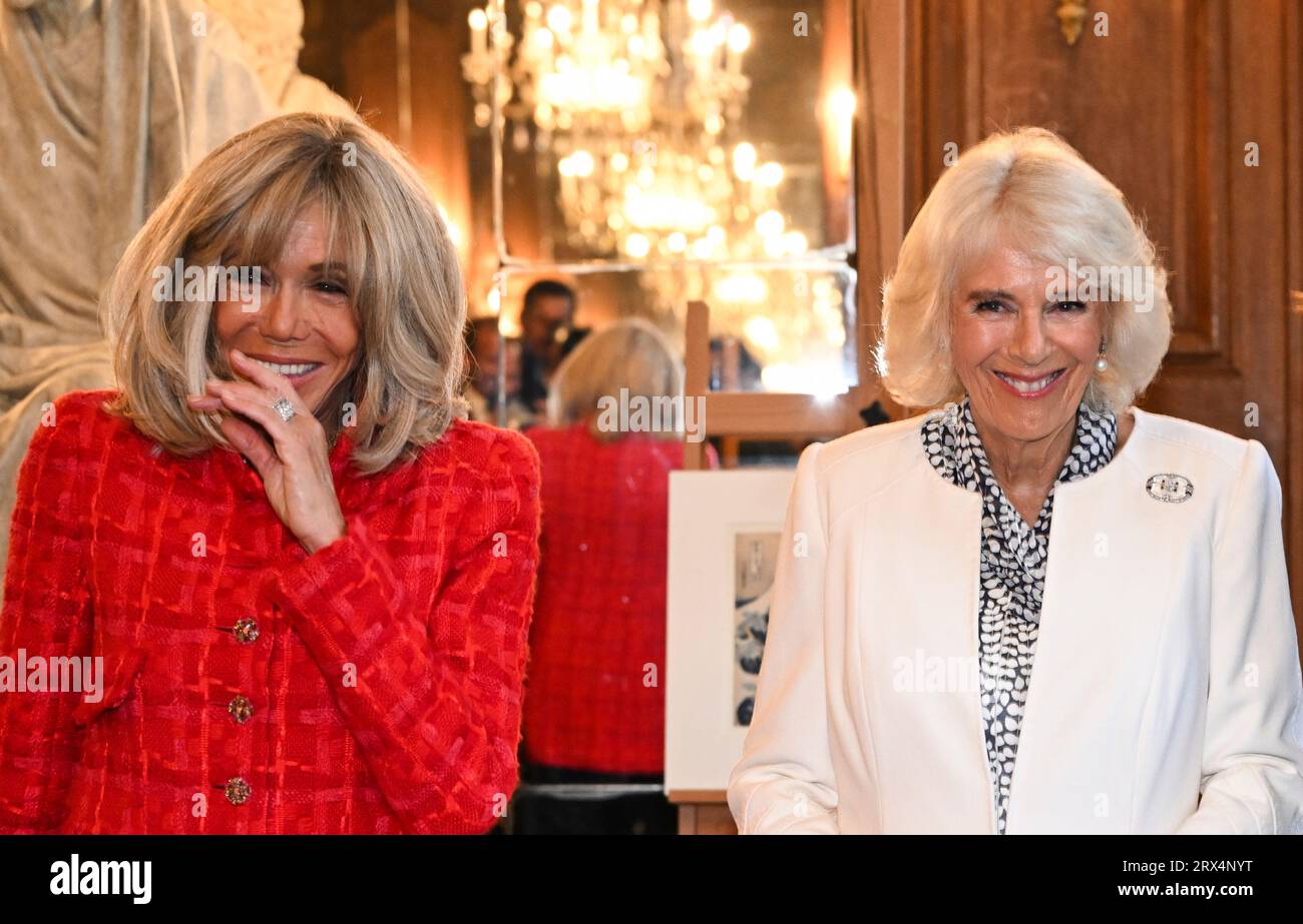 French President's wife Brigitte Macron, left, and Britain's Queen ...