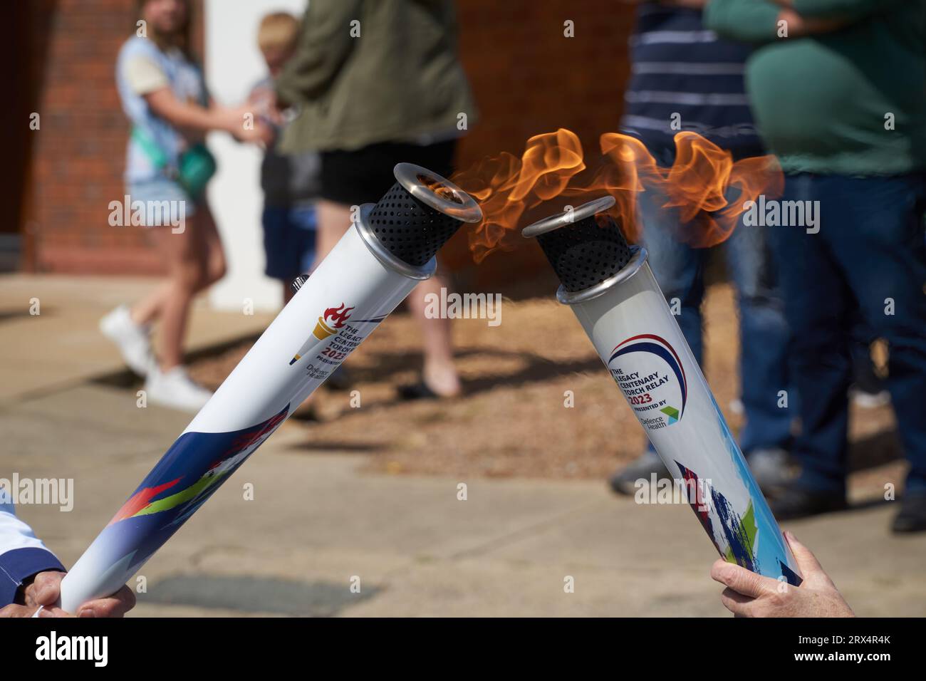 Passing the torch hi-res stock photography and images - Alamy