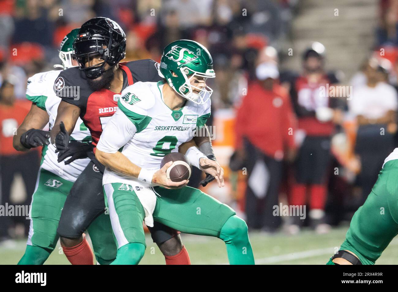 Ottawa, Canada. 22nd Sep, 2023. Saskatchewan Roughriders quarterback Jake Dolegala (9) avoids a ...