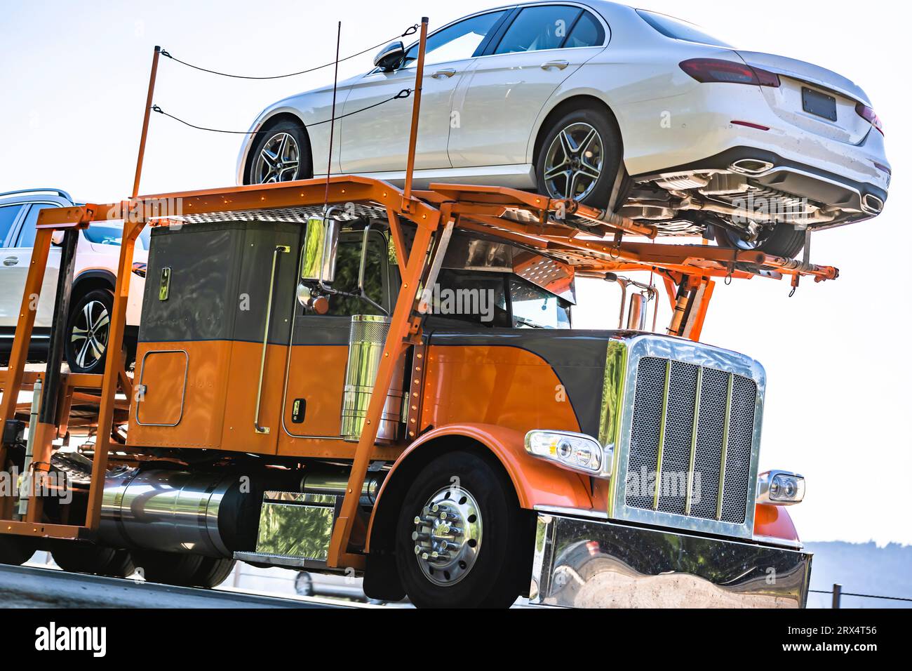 Bright orange industrial standard car hauler classic carrier big rig ...