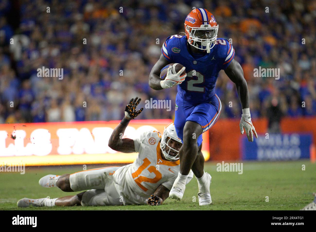 Florida running back Montrell Johnson Jr. (2) rushes for yardage past ...