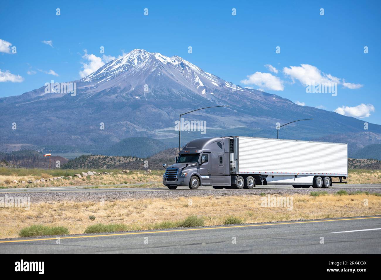 Industrial long hauler carrier gray big rig semi truck tractor with ...