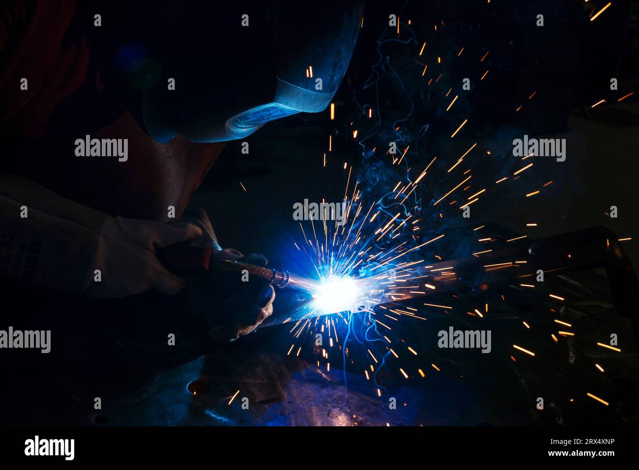horizontal view of welder working, France Stock Photo - Alamy