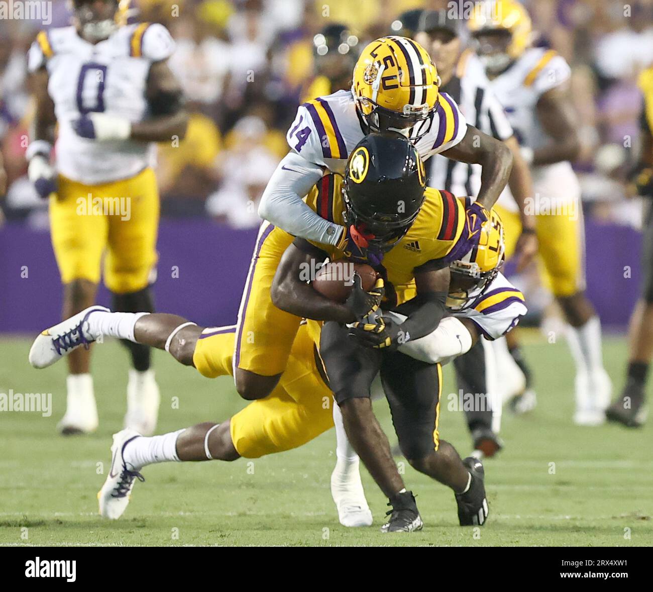 LSU Tigers safeties Andre' Sam (14) and Major Burns (8) both tackle ...