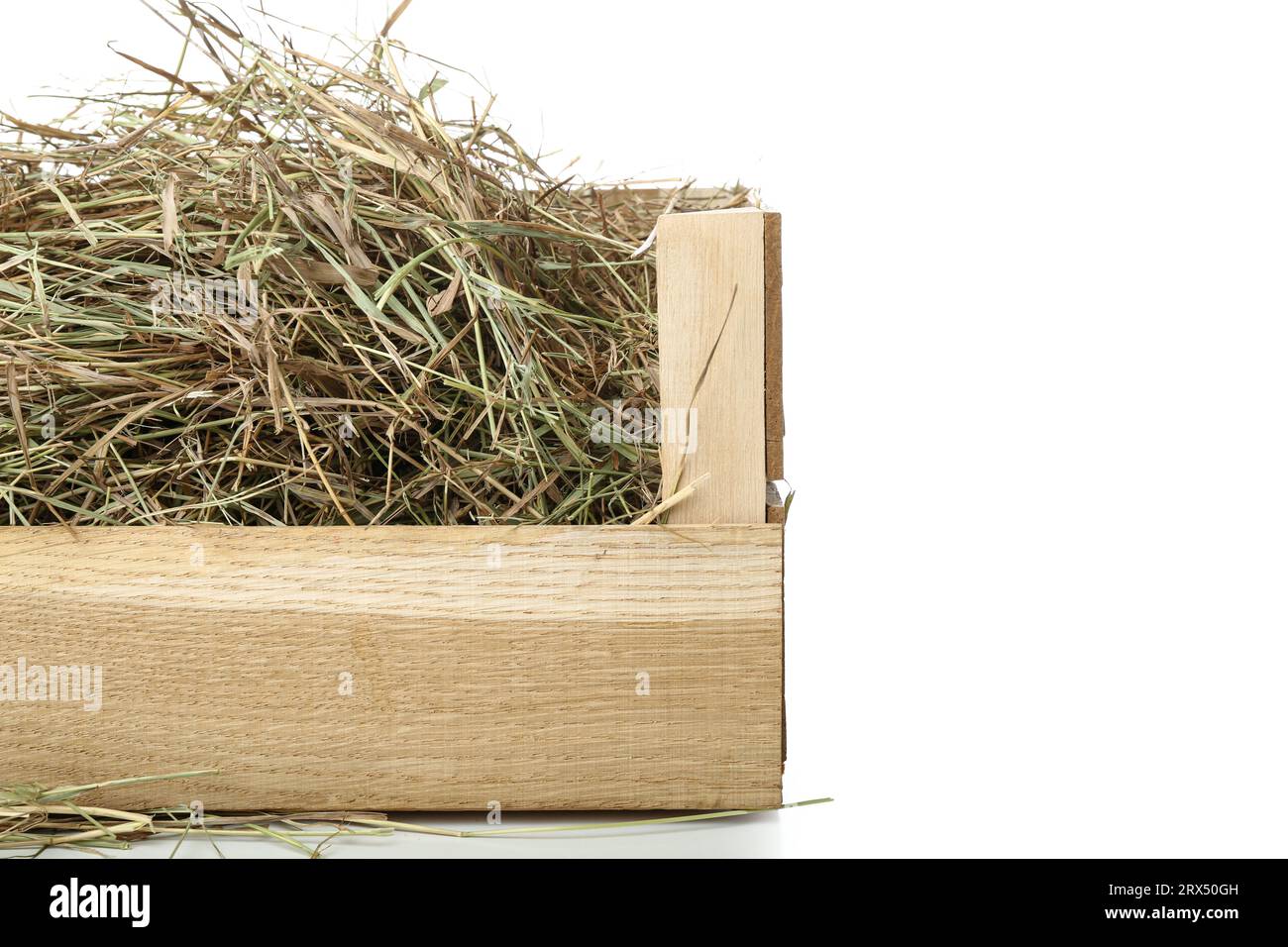 Straw in crate on white background Stock Photo - Alamy