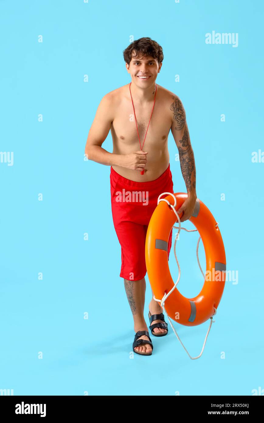 Lifeguard running into the sea hi-res stock photography and images - Alamy