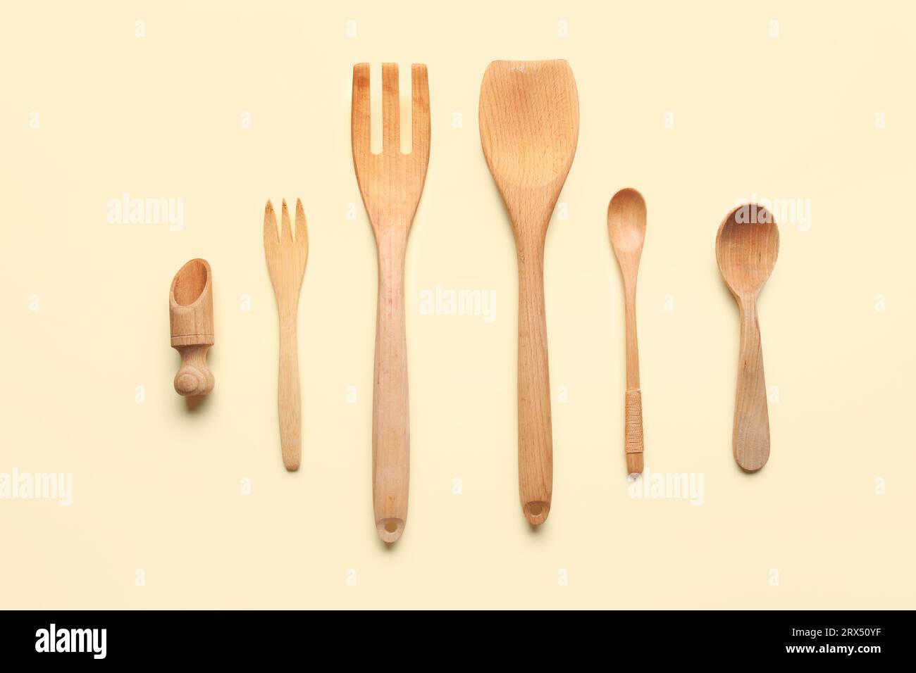 Set of wooden kitchen utensils on color background Stock Photo - Alamy