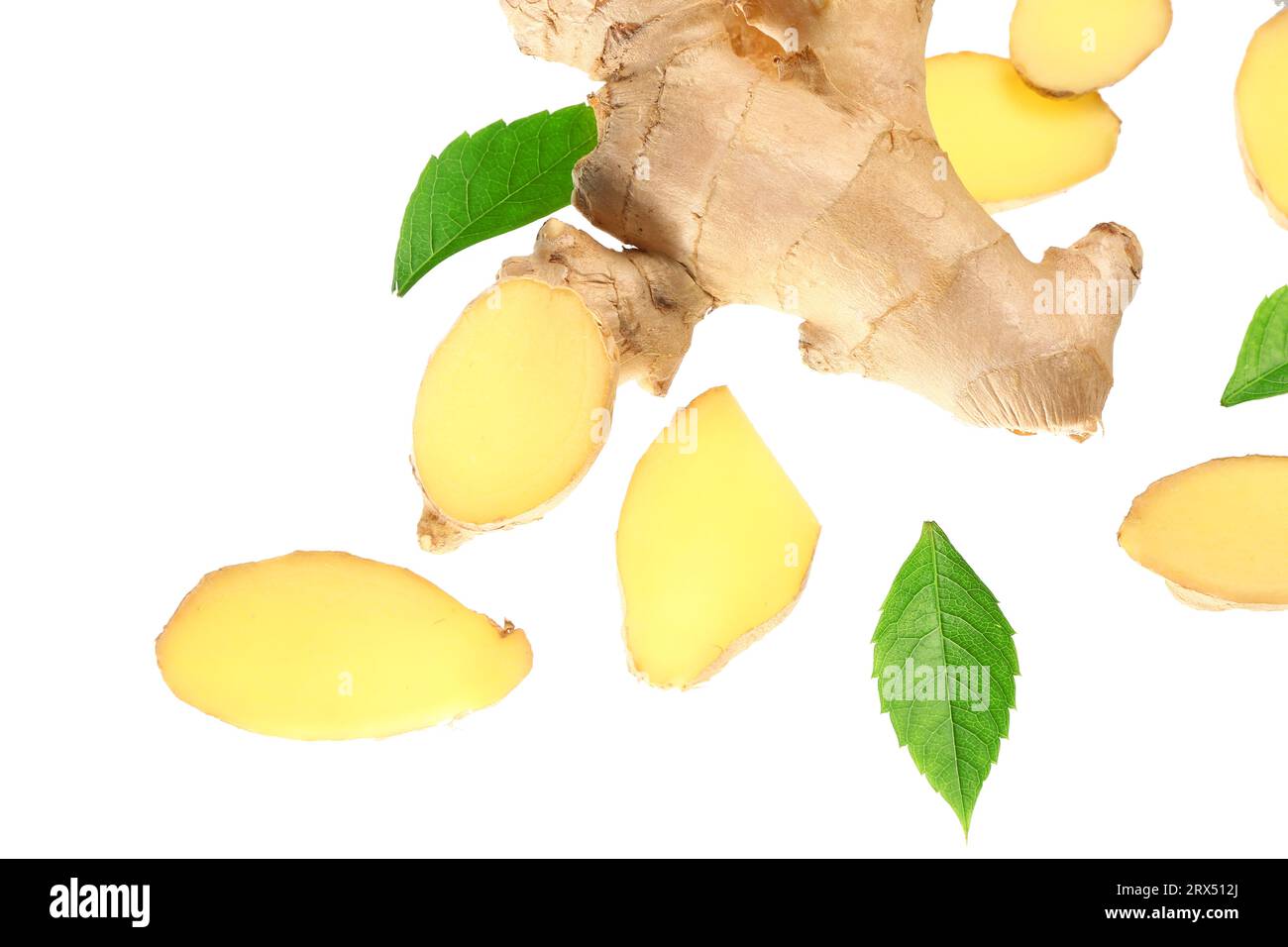 Flying fresh ginger root and leaves on white background Stock Photo - Alamy