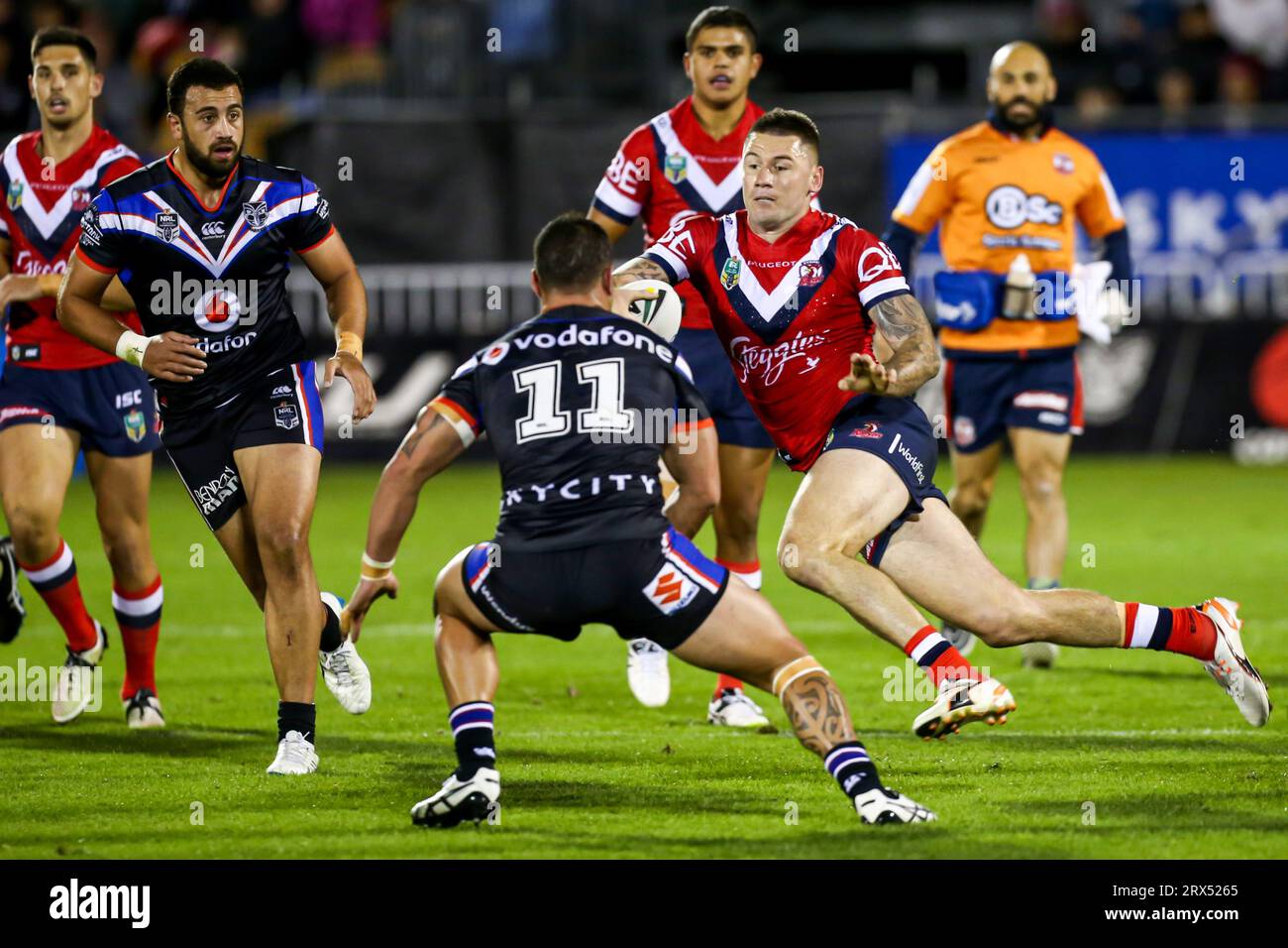 Shaun Kenny-Dowall of the Roosters is challenged by Bodene Thompson of ...