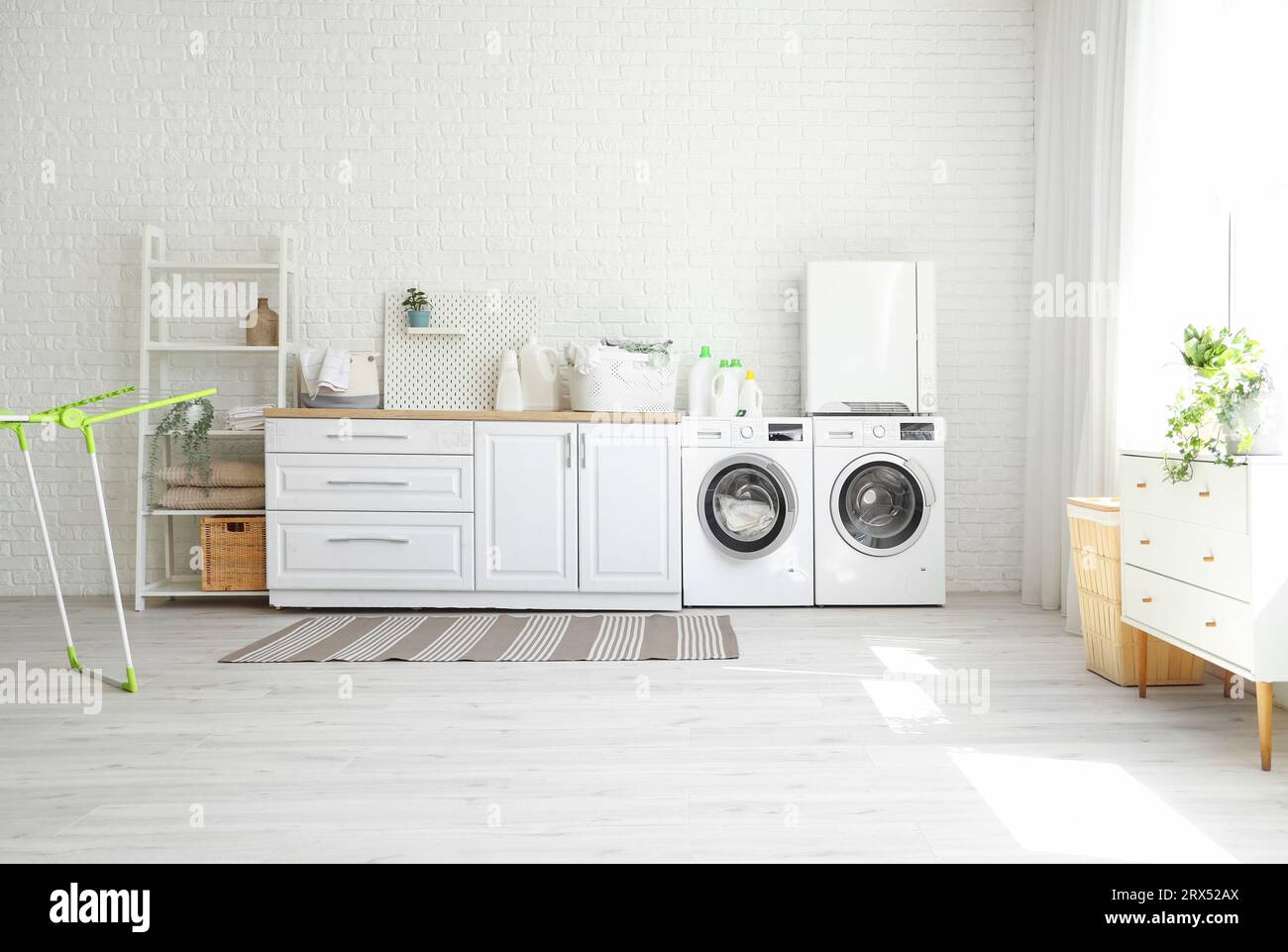 Interior of laundry room with washing machines Stock Photo - Alamy
