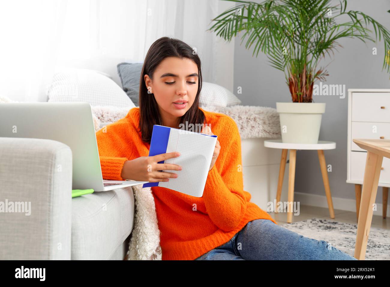 Young woman learning English language online at home Stock Photo - Alamy
