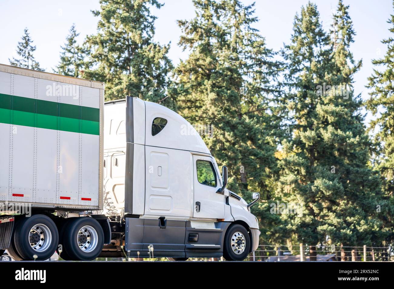 Industrial grade loaded long hauler carrier white big rig semi truck ...