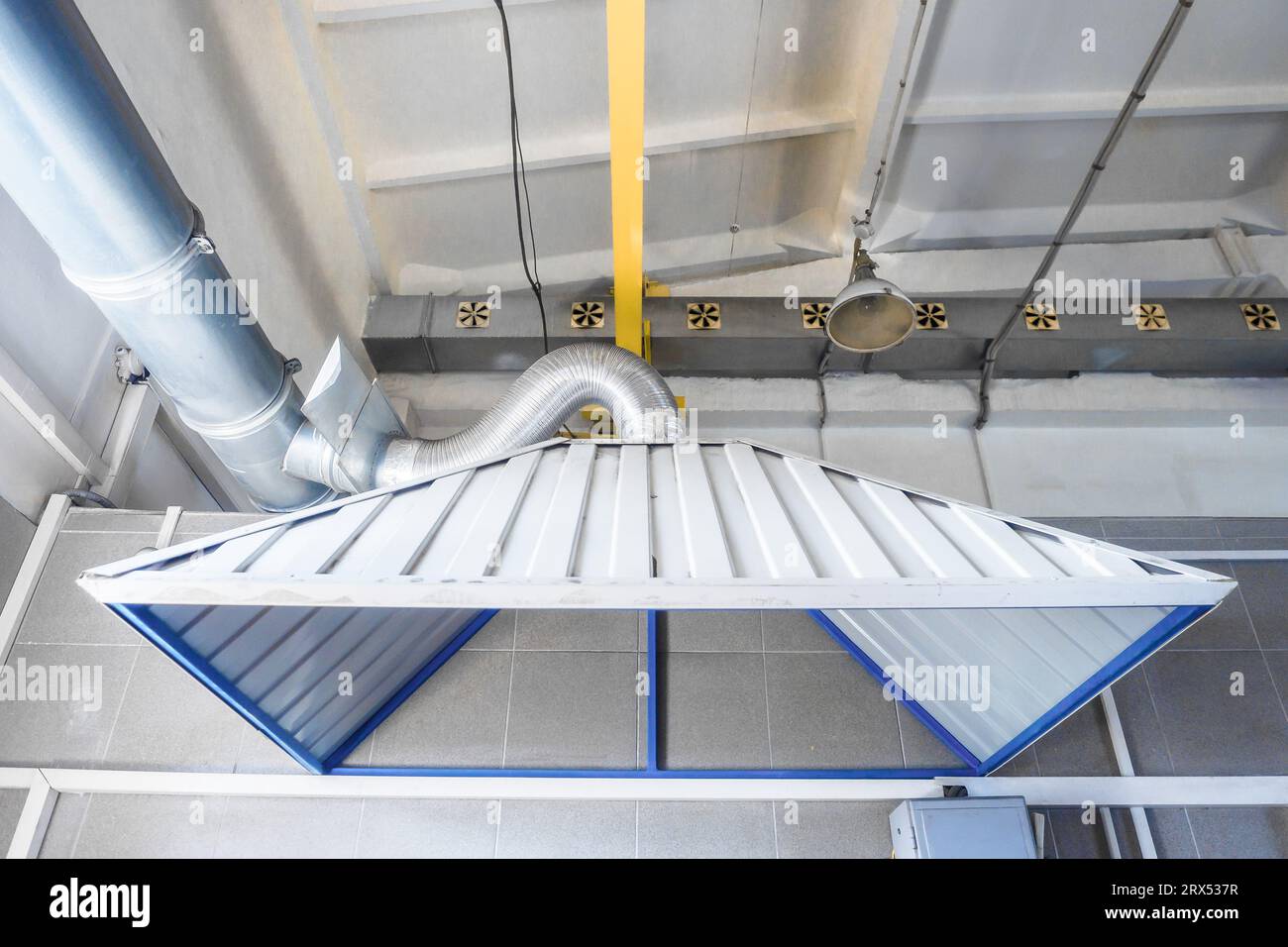 Industrial hood in production workshop. Room ventilation system ...