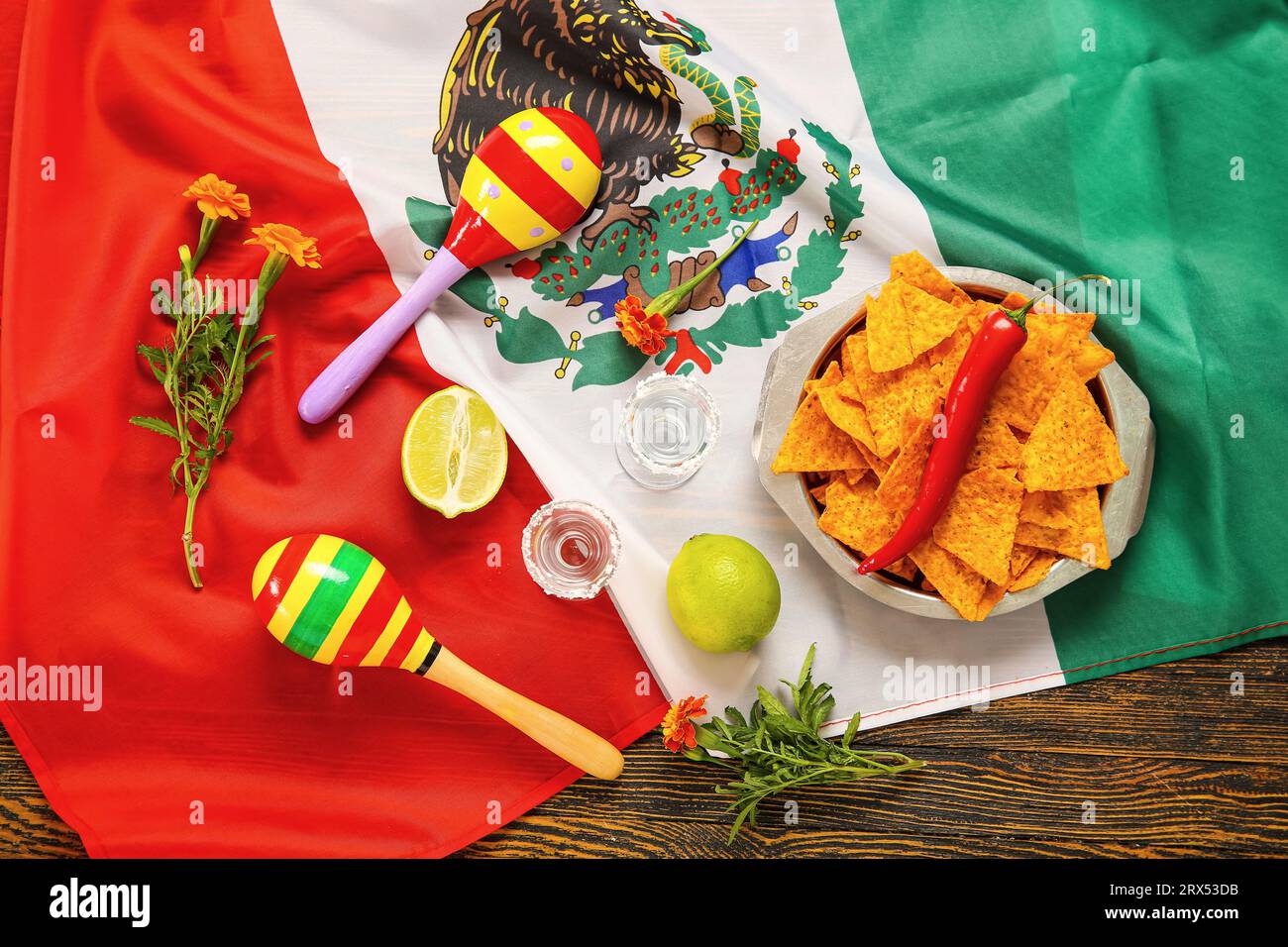 Mexican flag with tequila shots and food for Independence Day on wooden ...