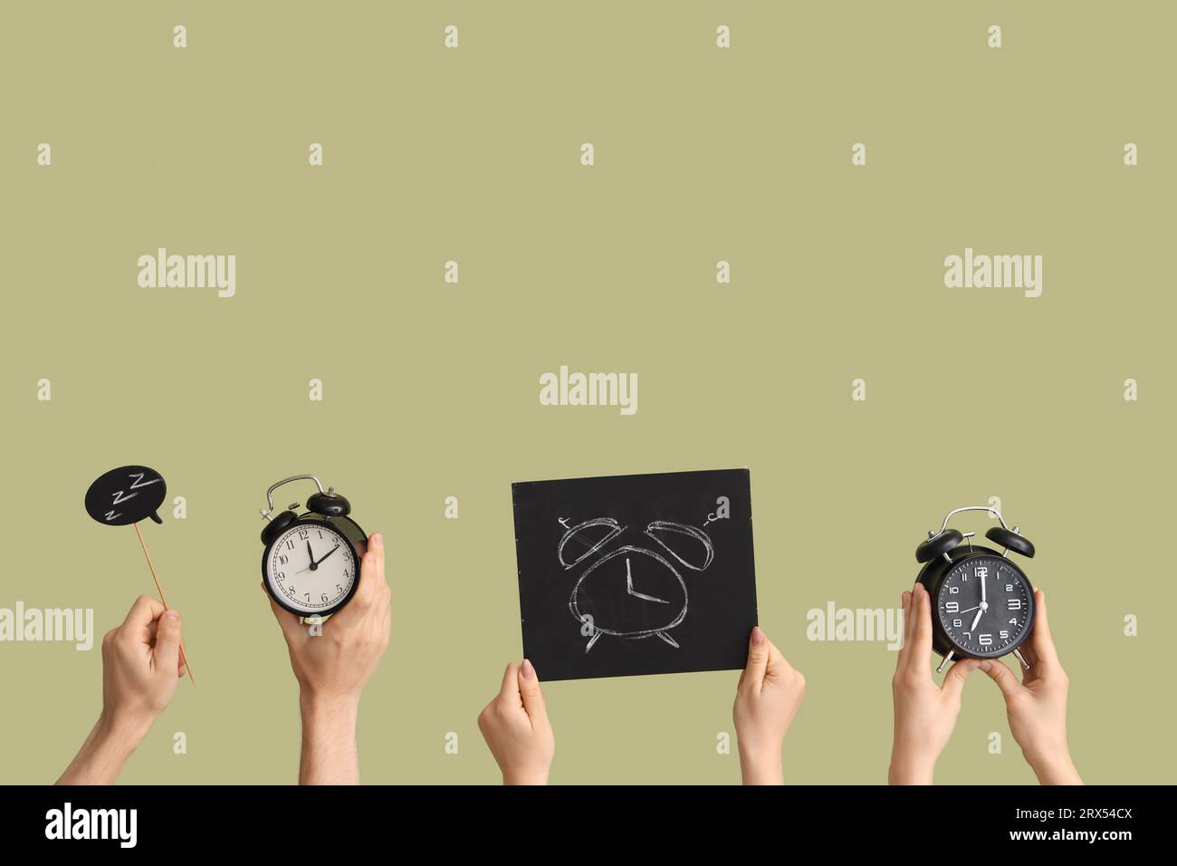 Hands holding alarm clocks, board with drawing and speech bubble on ...