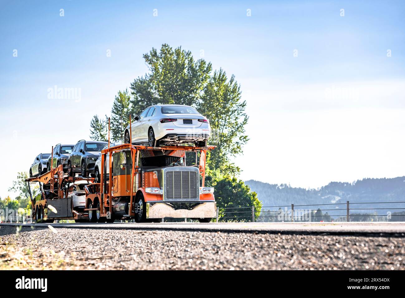 Bright orange industrial standard car hauler classic carrier big rig ...