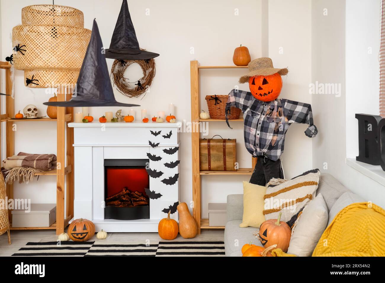 Interior of living room decorated for Halloween with fireplace ...
