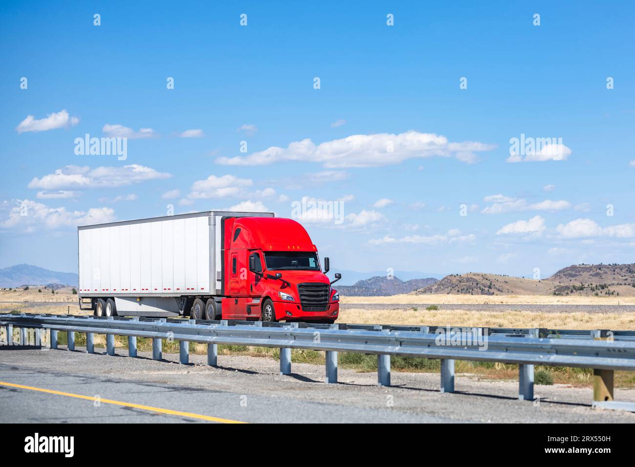 Industrial long hauler carrier red big rig semi truck tractor with high ...