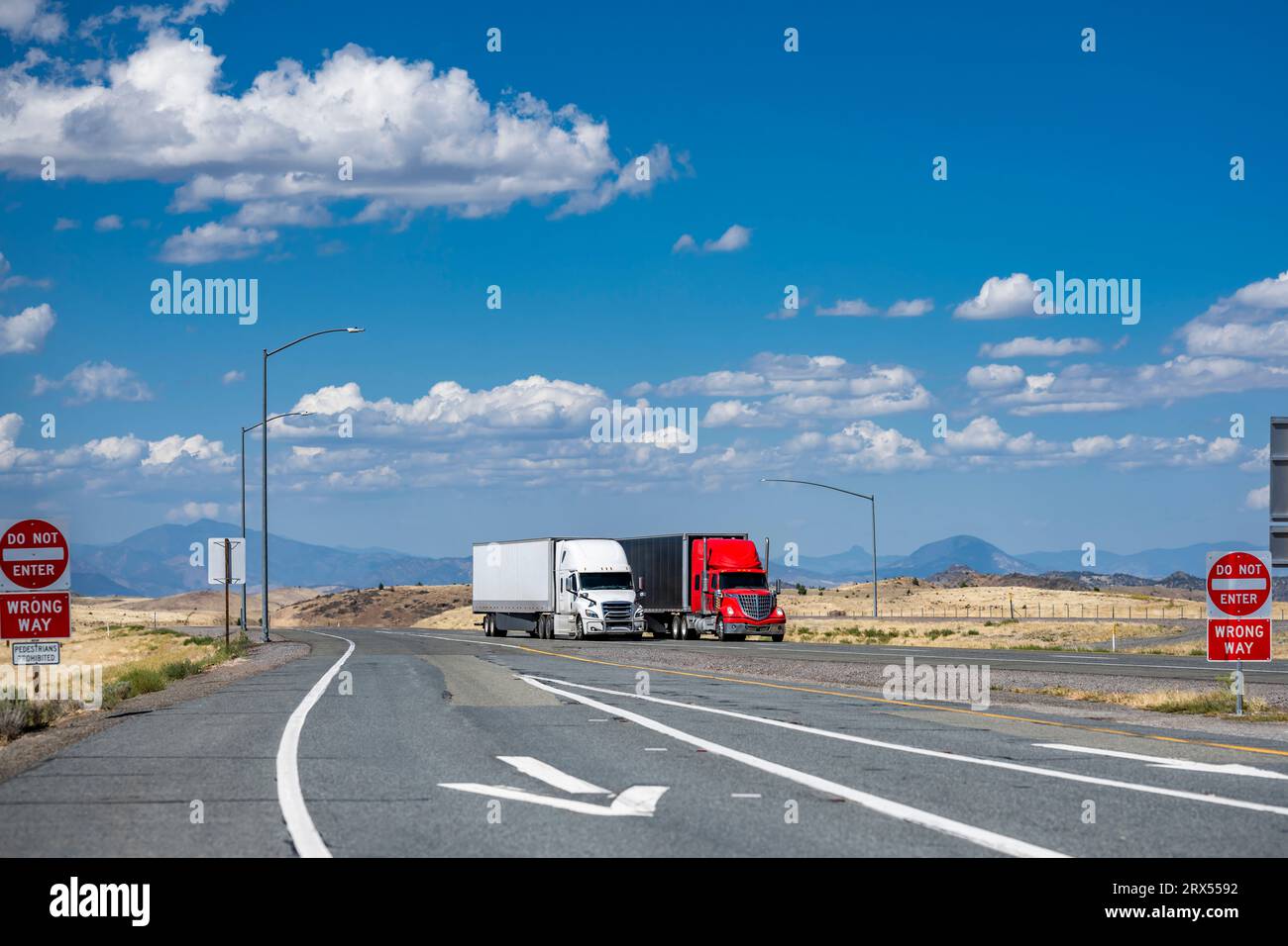 Industrial long hauler carriers two big rig semi trucks with high cabs ...