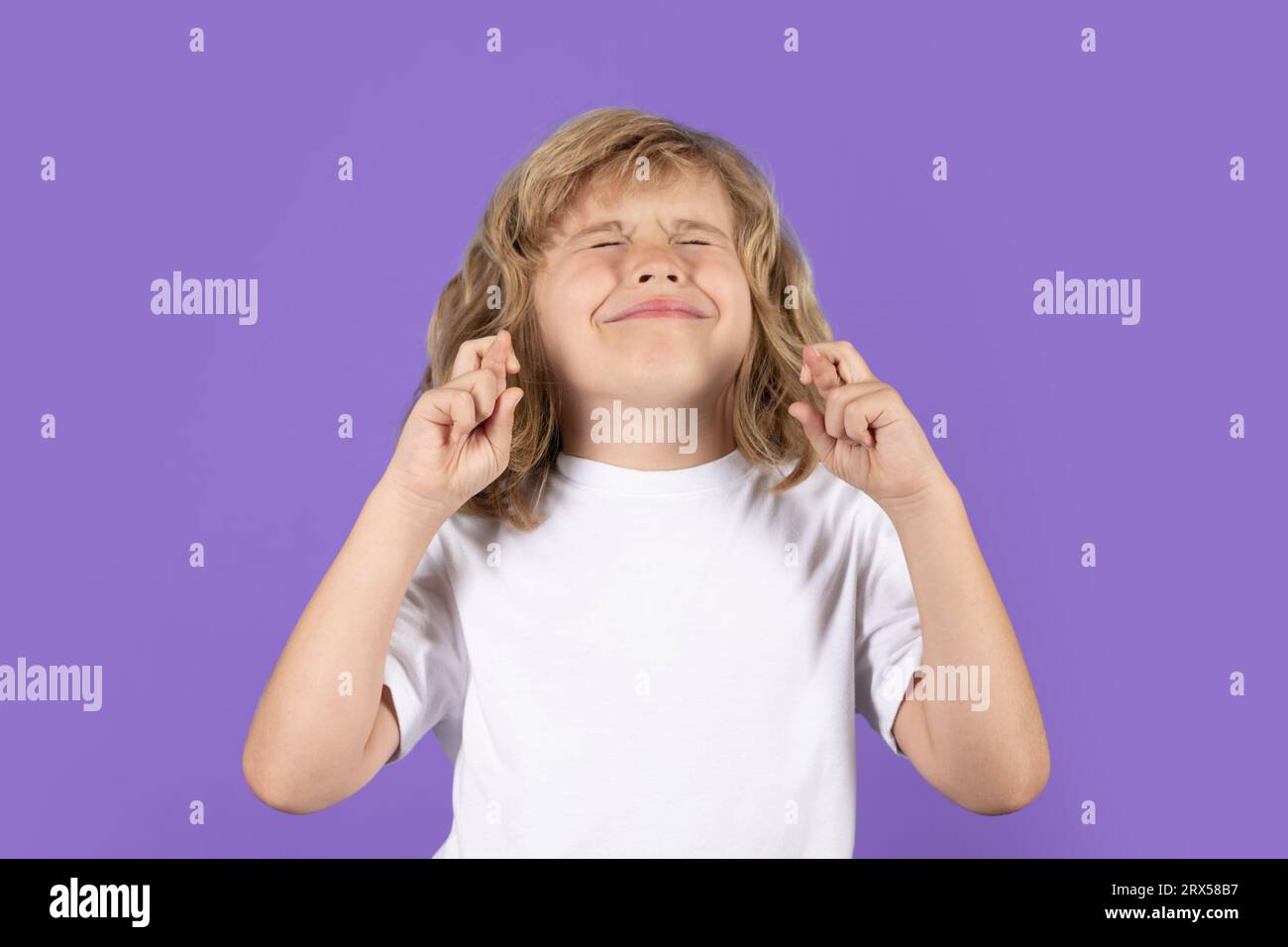 Portrait of cute smiling child crossed fingers, , isolated studio ...