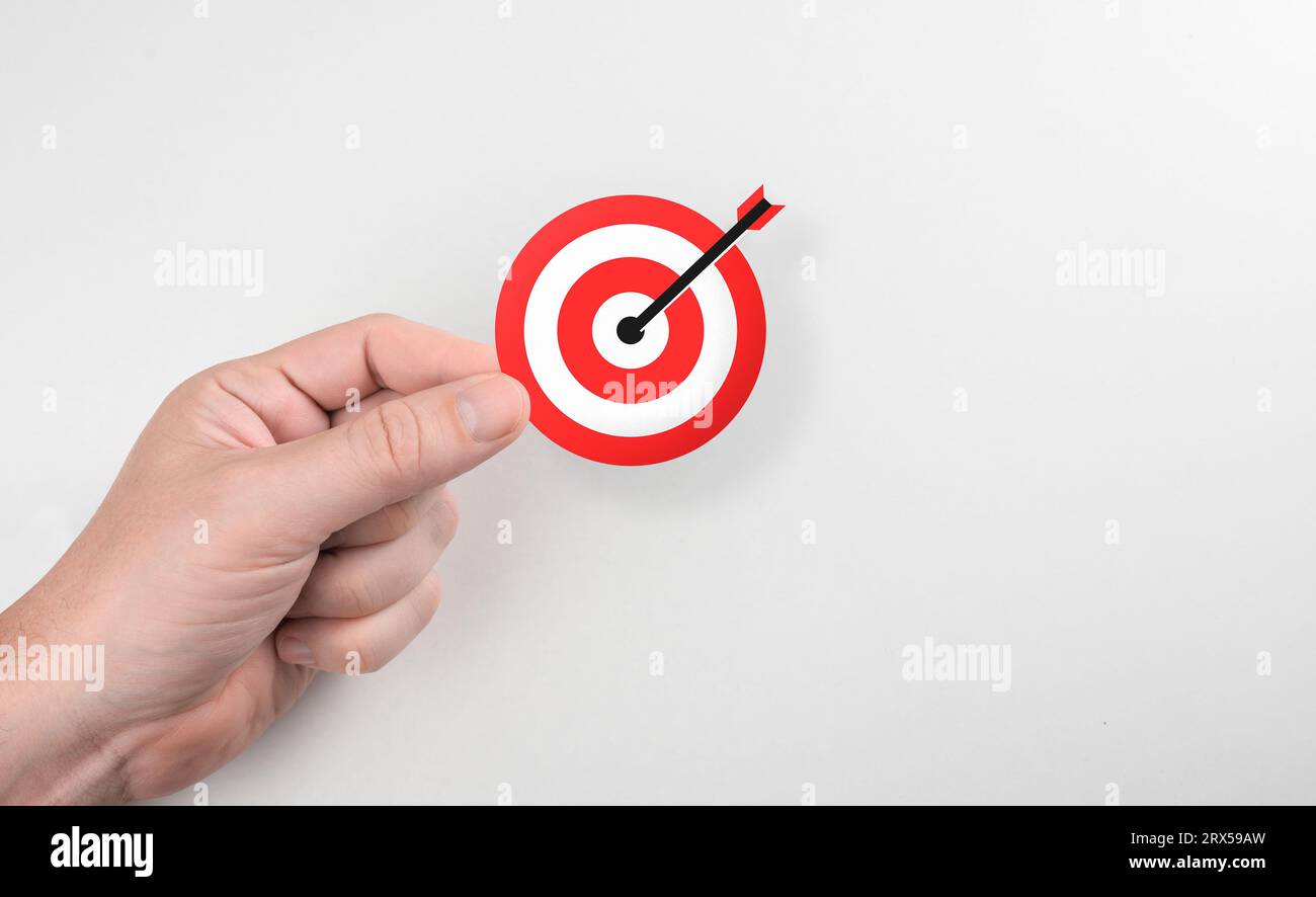 Setting goals, strategy, success concept. Businessman holding target ...
