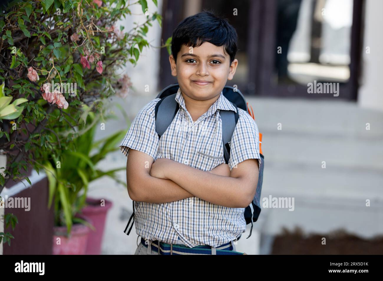 Portrait of happy indian boy student wearing school backpack standing ...