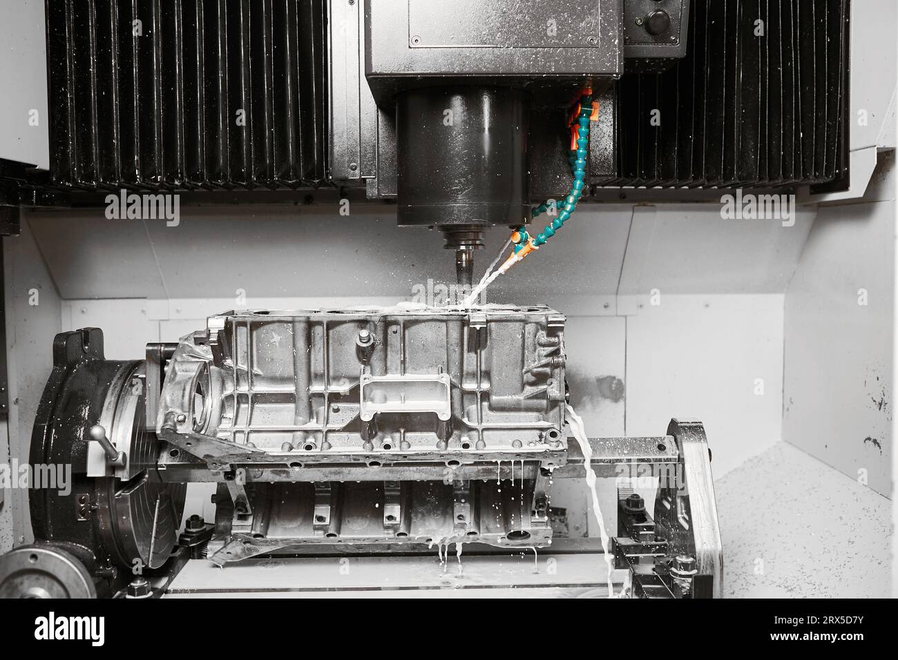 High precision cnc milling machine makes holes in the car engine Stock ...