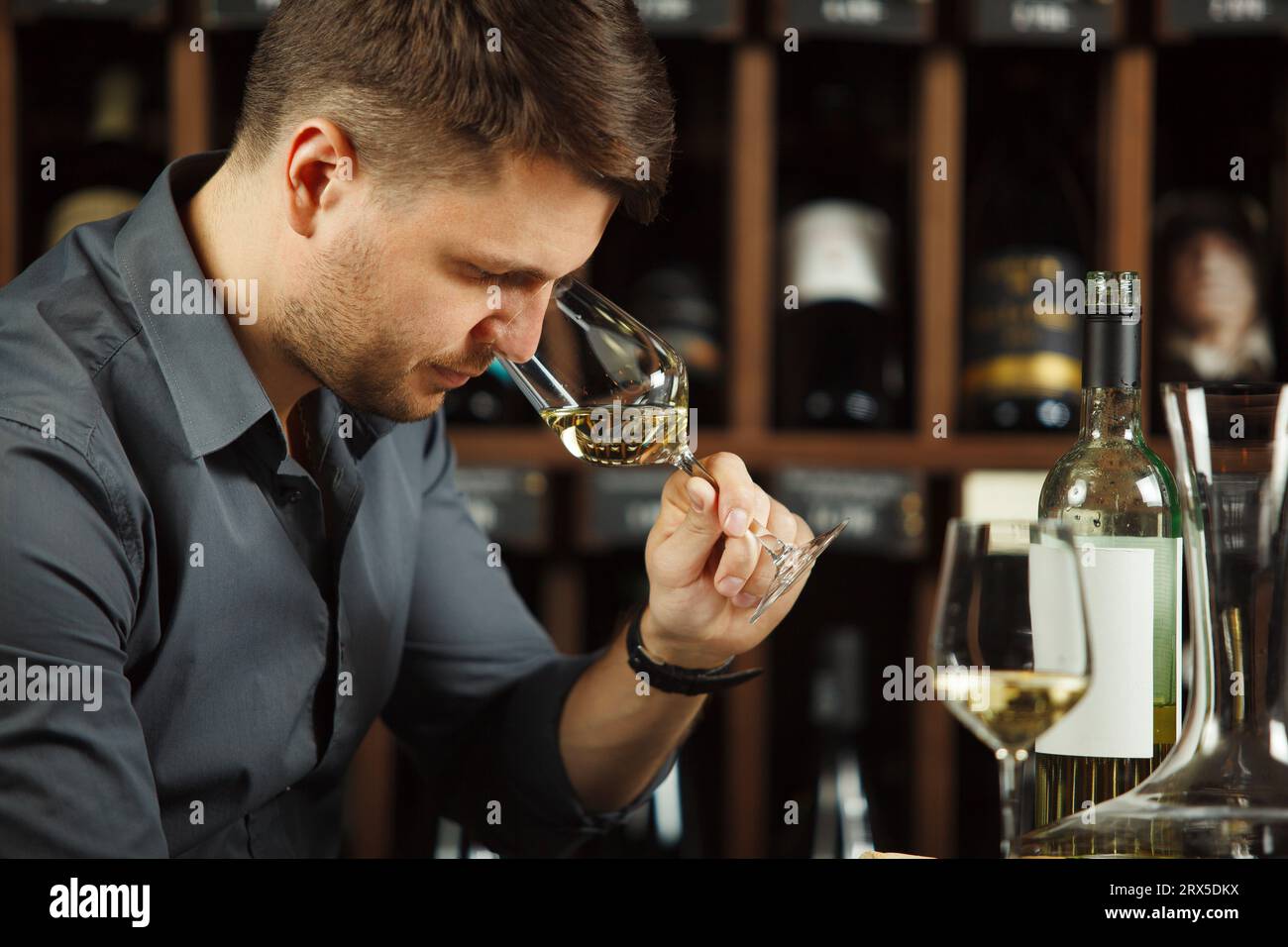 Degustation process of sommelier in wine cellar Stock Photo - Alamy