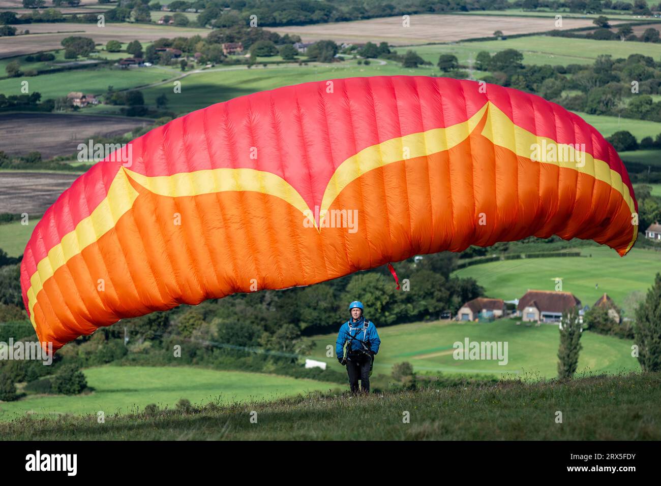 Brighton, September 22nd 2023: A parascender taking off from Devil's ...