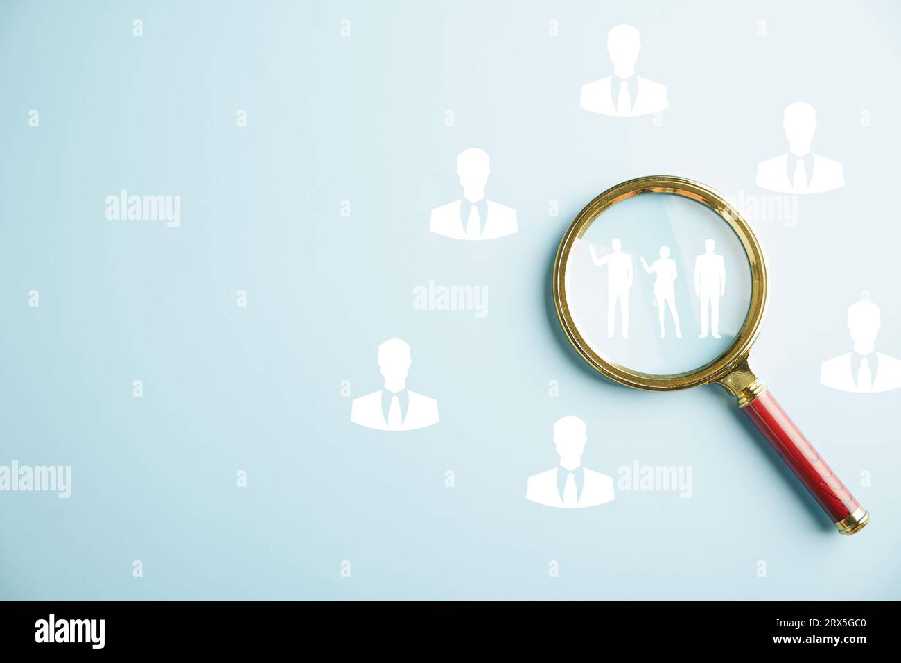 Focused magnifying glass on job search concept Stock Photo - Alamy
