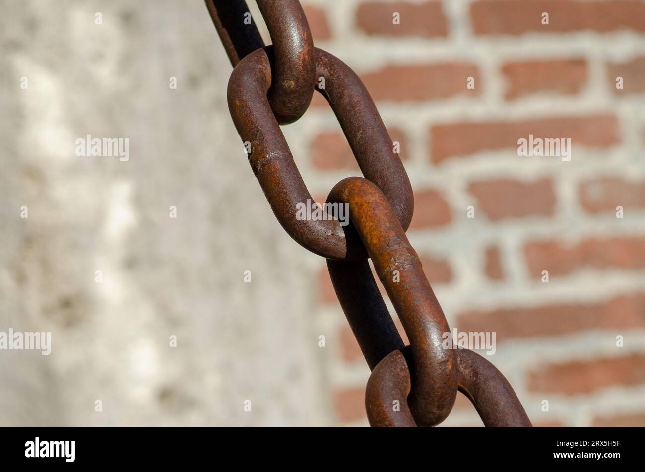 rusty chains brick background, a symbol of strength and oppression ...