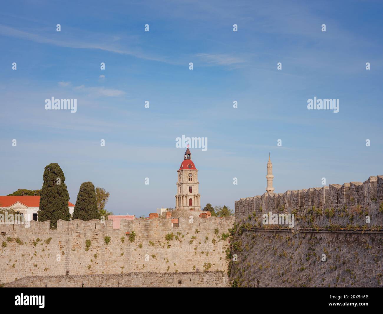 The walls of the medieval city of Rhodes, the clock tower inside the ...