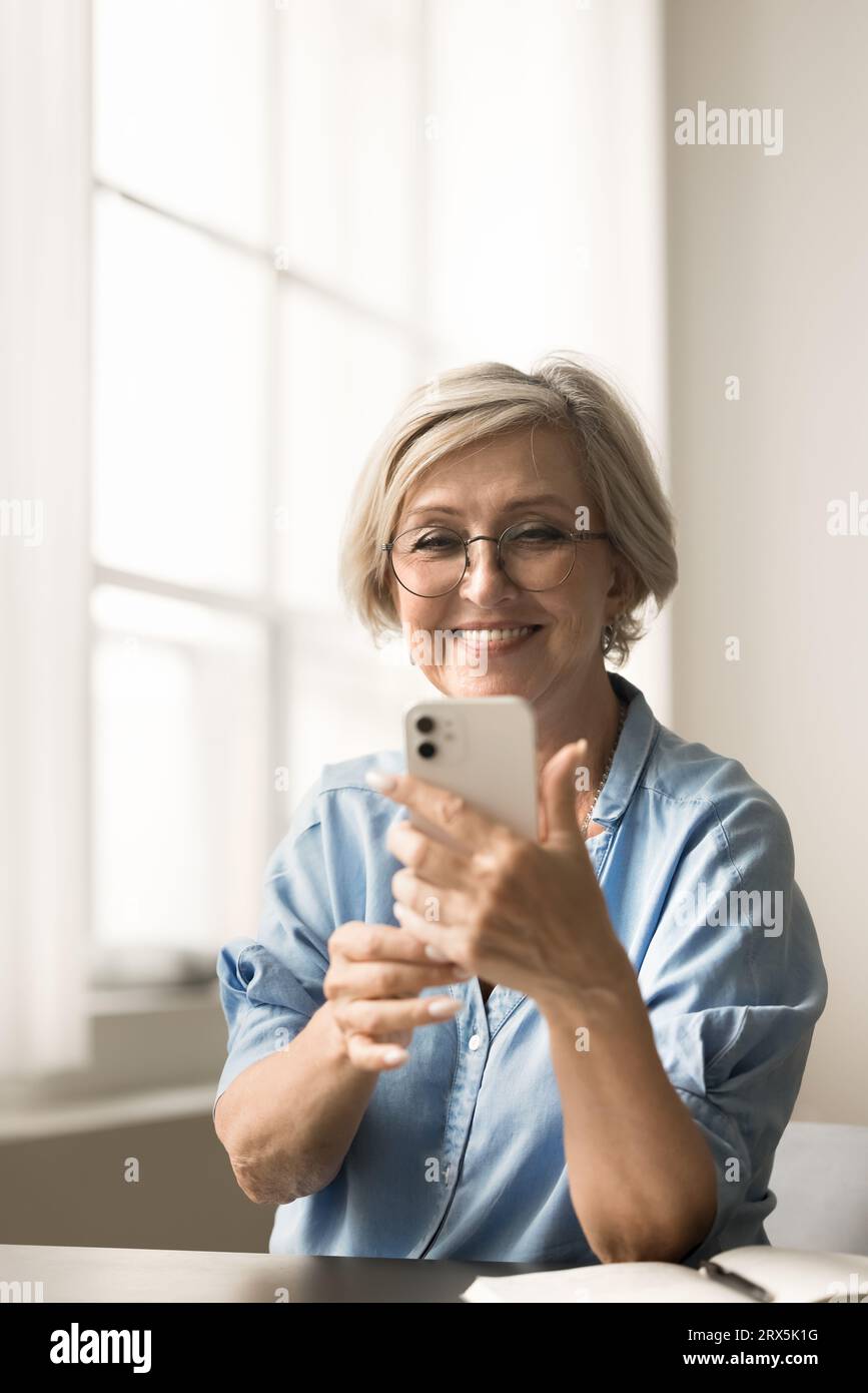 Happy retired lady in stylish glasses taking selfie picture Stock Photo ...
