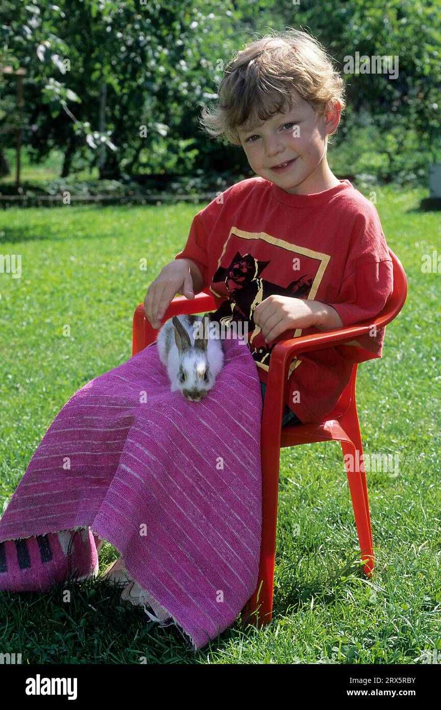 Boy with rabbit Stock Photo - Alamy