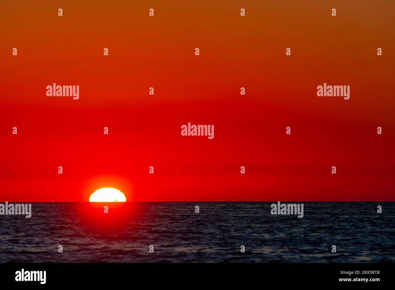 The sun rises on the Pacific Ocean in Baja California Stock Photo - Alamy