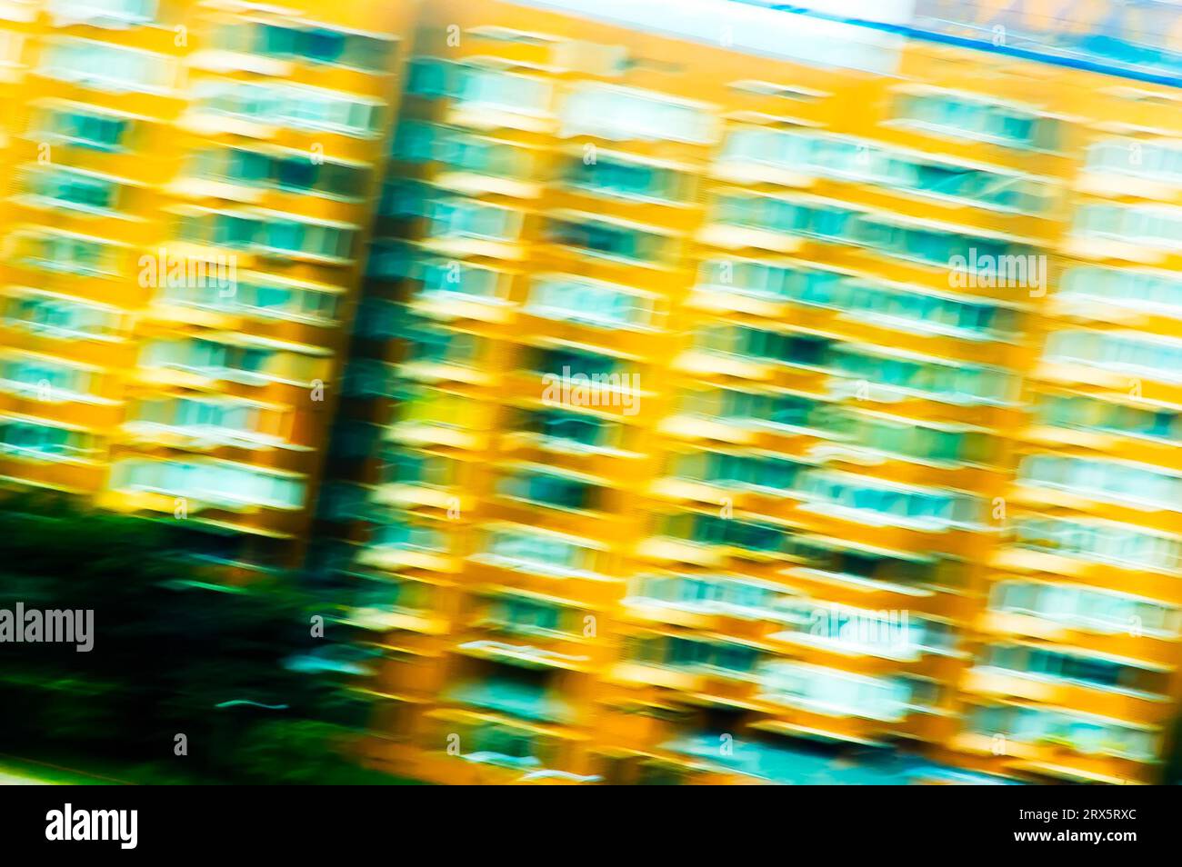 A building blurred texture effect in yellow and blue Stock Photo - Alamy